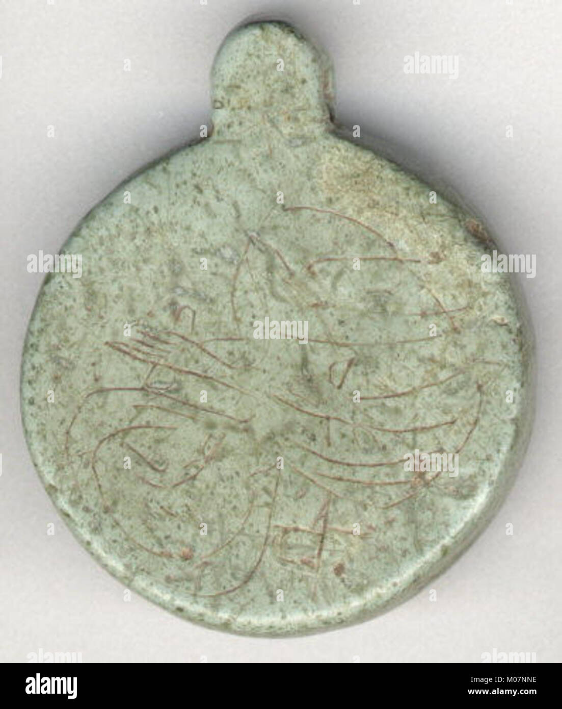 This medallion depicts the head of a saint, showcasing medieval ...