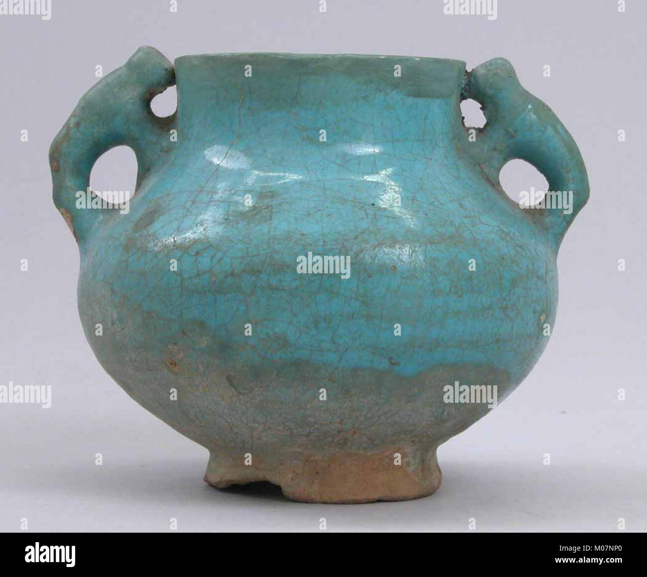 A ceramic jar from an ancient culture, characterized by its simple ...