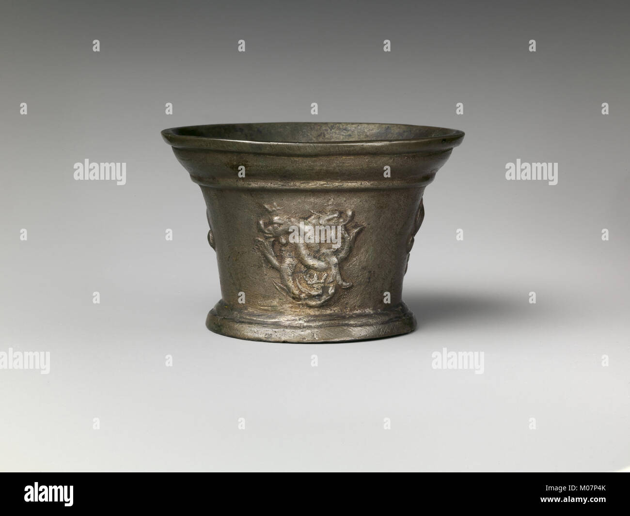 This historic mortar, used for grinding and mixing, demonstrates ...