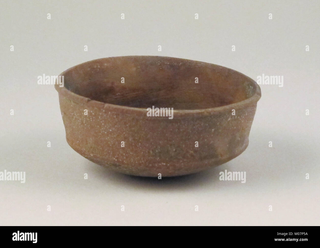 This miniature kylix, a small drinking cup, is decorated with intricate ...