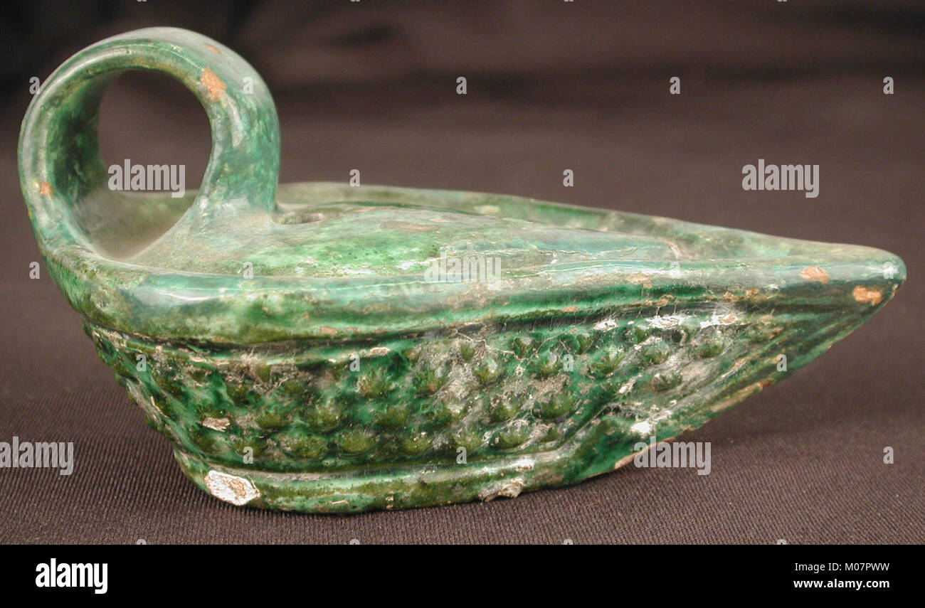 This ancient lamp, part of the museum's collection, exemplifies ...