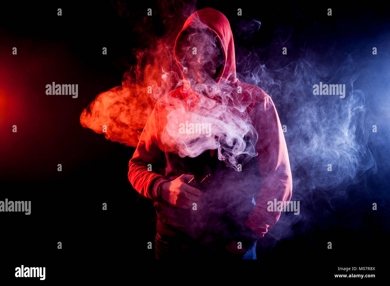 Man vaping an electronic cigarette.Isolated on black background Stock ...