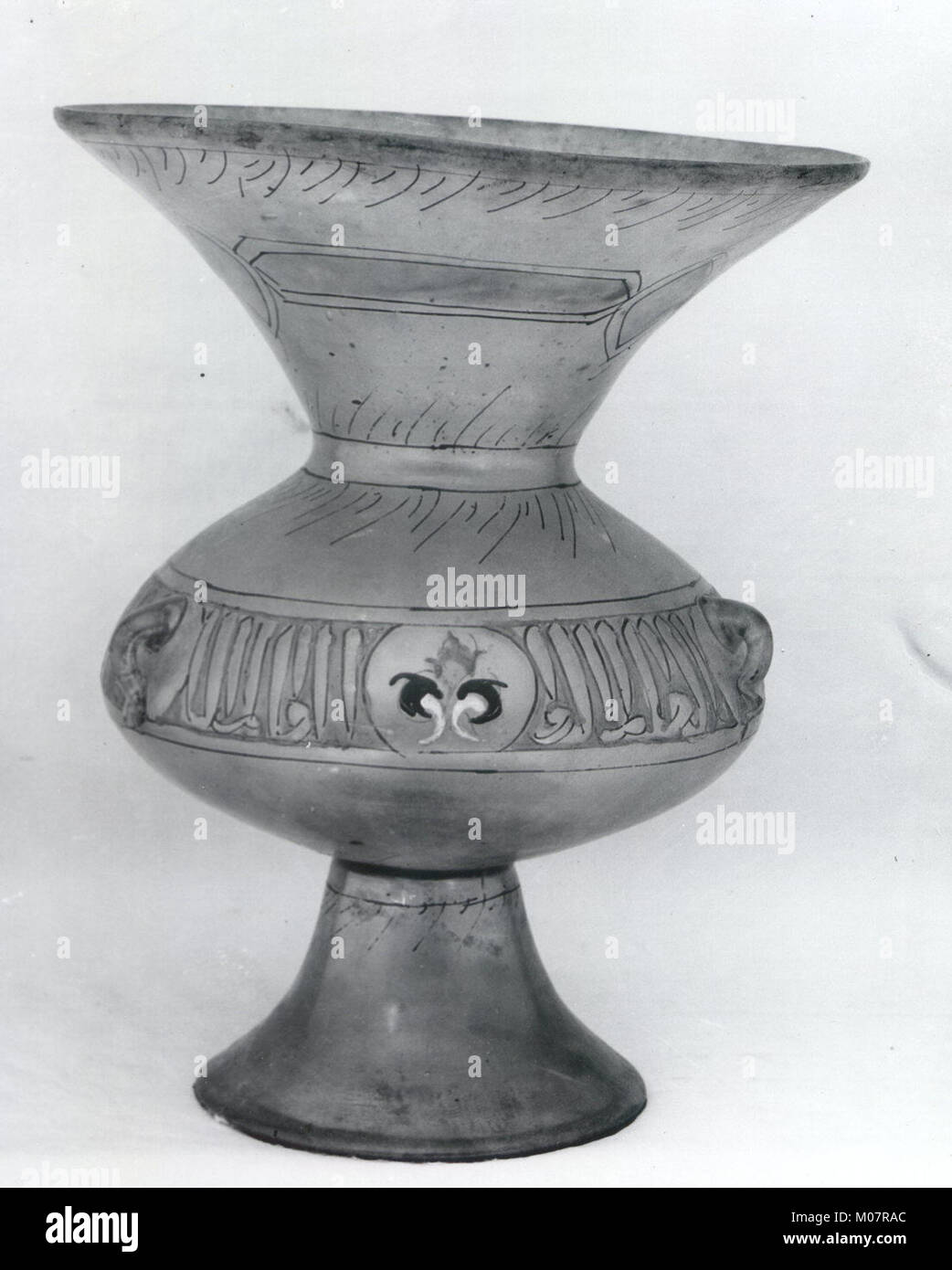 This mosque lamp, an exquisite example of Islamic metalwork, features ...