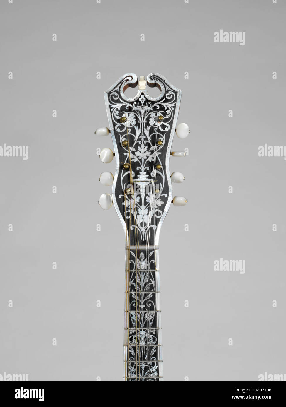 This mandolin, a stringed musical instrument, exemplifies craftsmanship ...