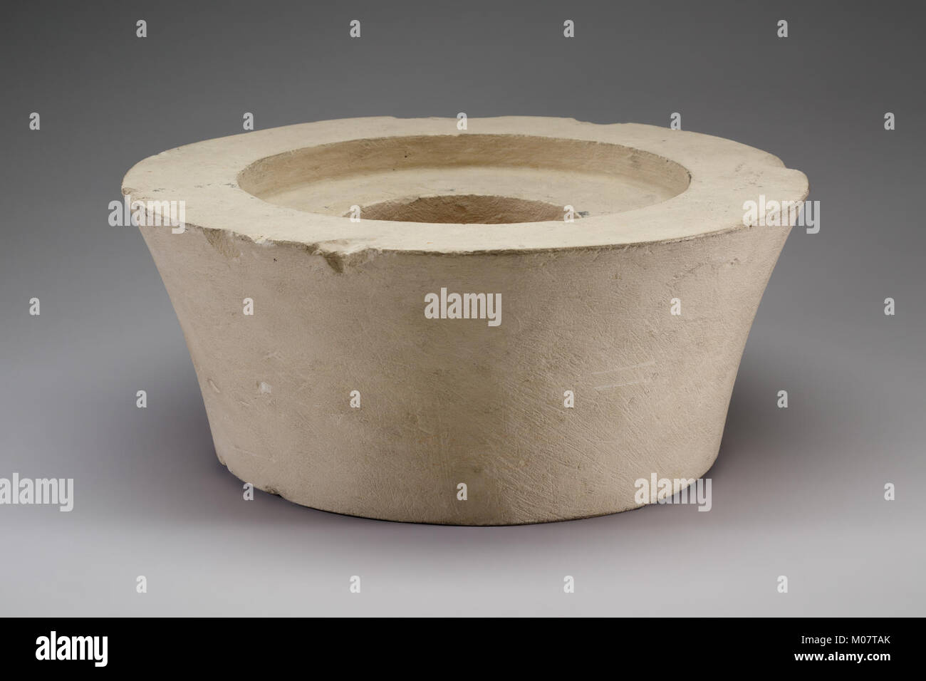 This lamp wick holder is an ancient lighting accessory for holding oil ...