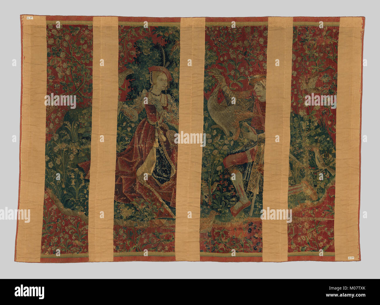 This artwork portrays a huntsman presenting a heron to a lady falconer ...