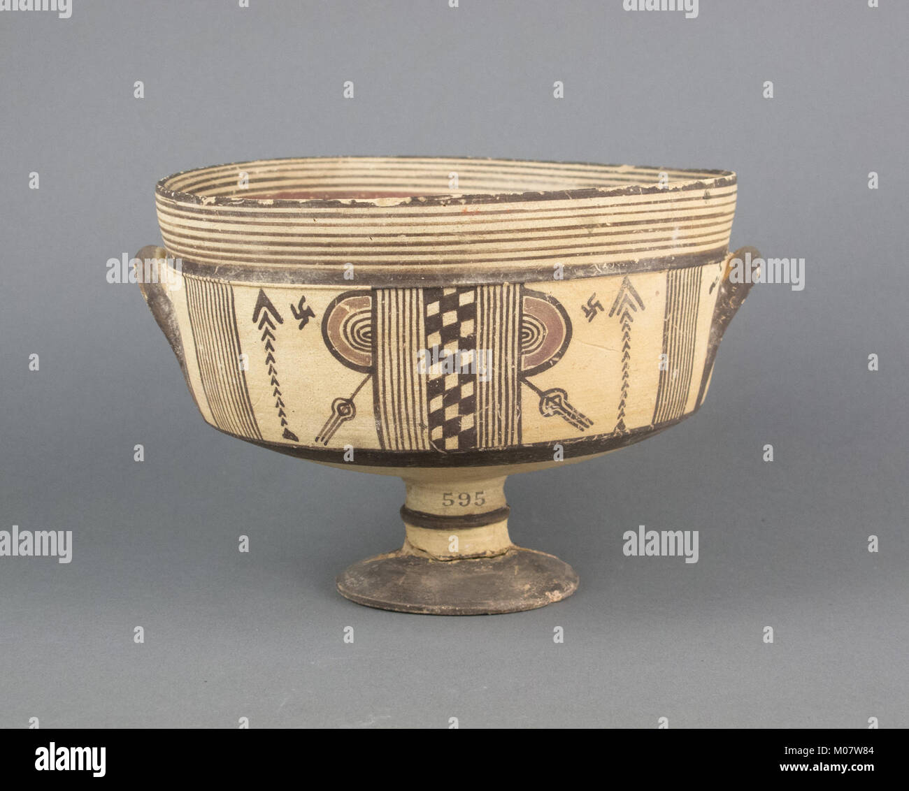 This kylix is an ancient Greek drinking vessel, illustrating artistry ...