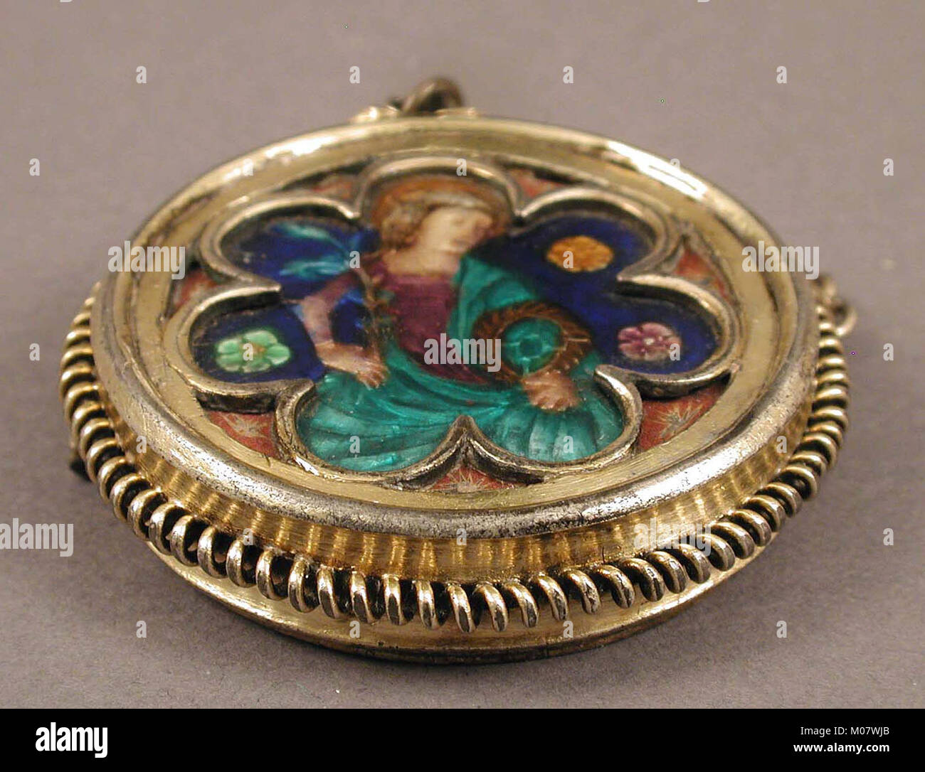 This locket, made of metal and glass, is designed as a decorative ...