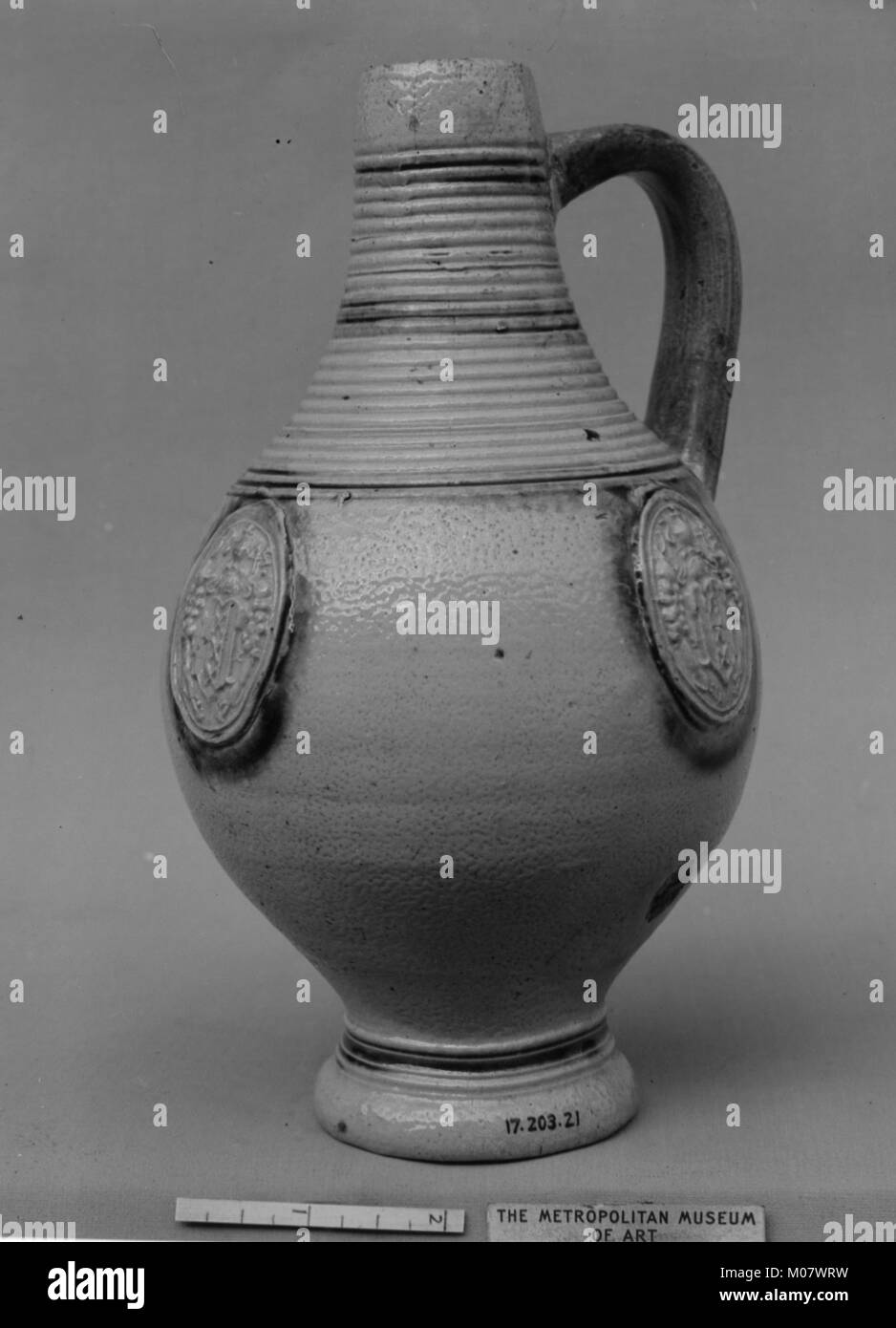 This ceramic jug served as a functional vessel for liquids, reflecting ...