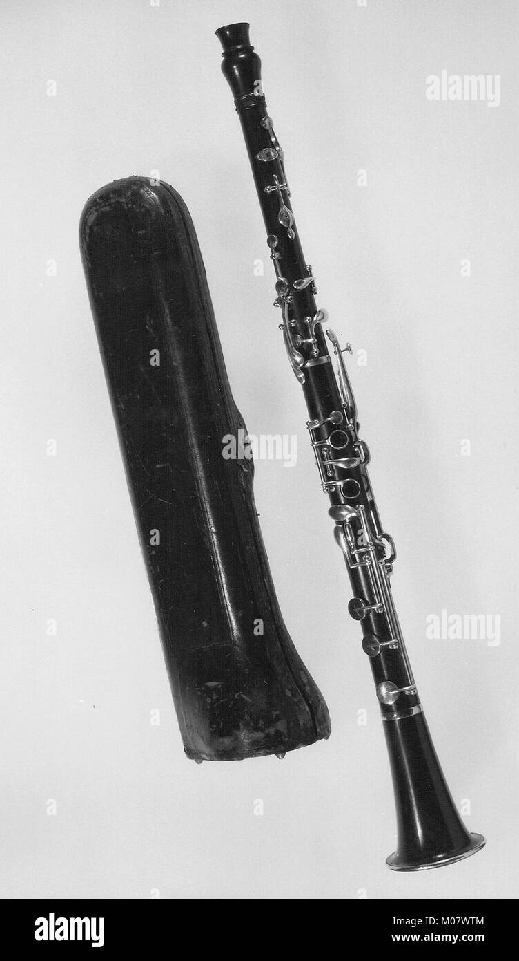 This oboe, crafted from wood, showcases the fine craftsmanship of ...