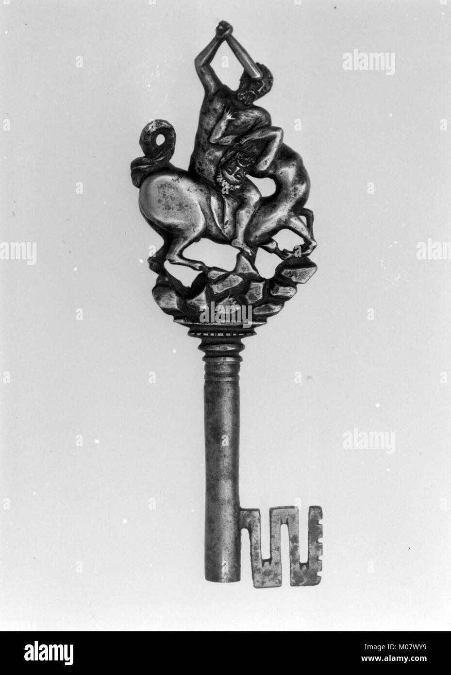 A historical key made of metal, demonstrating functional design used ...