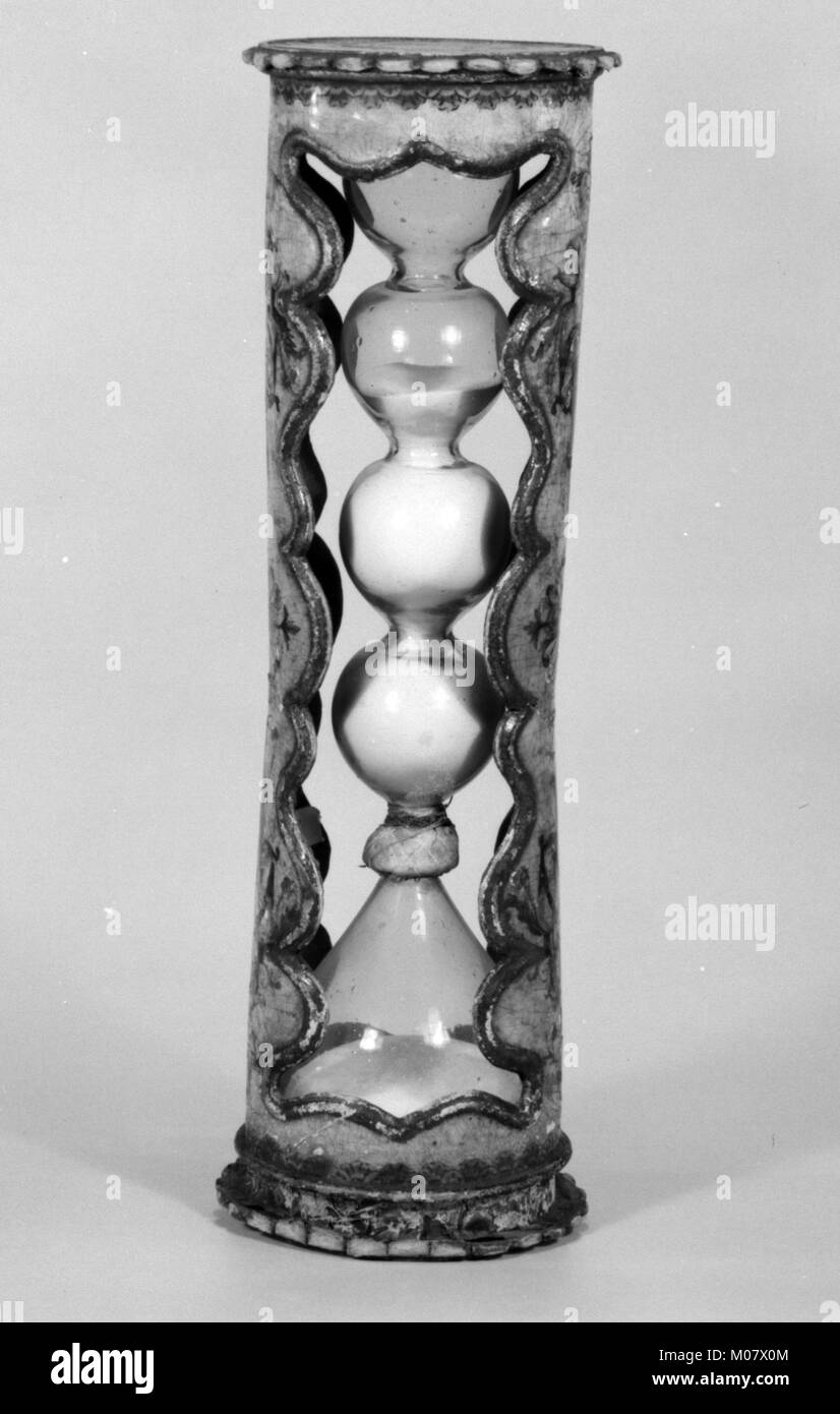 An hourglass, an ancient timekeeping device consisting of two glass ...