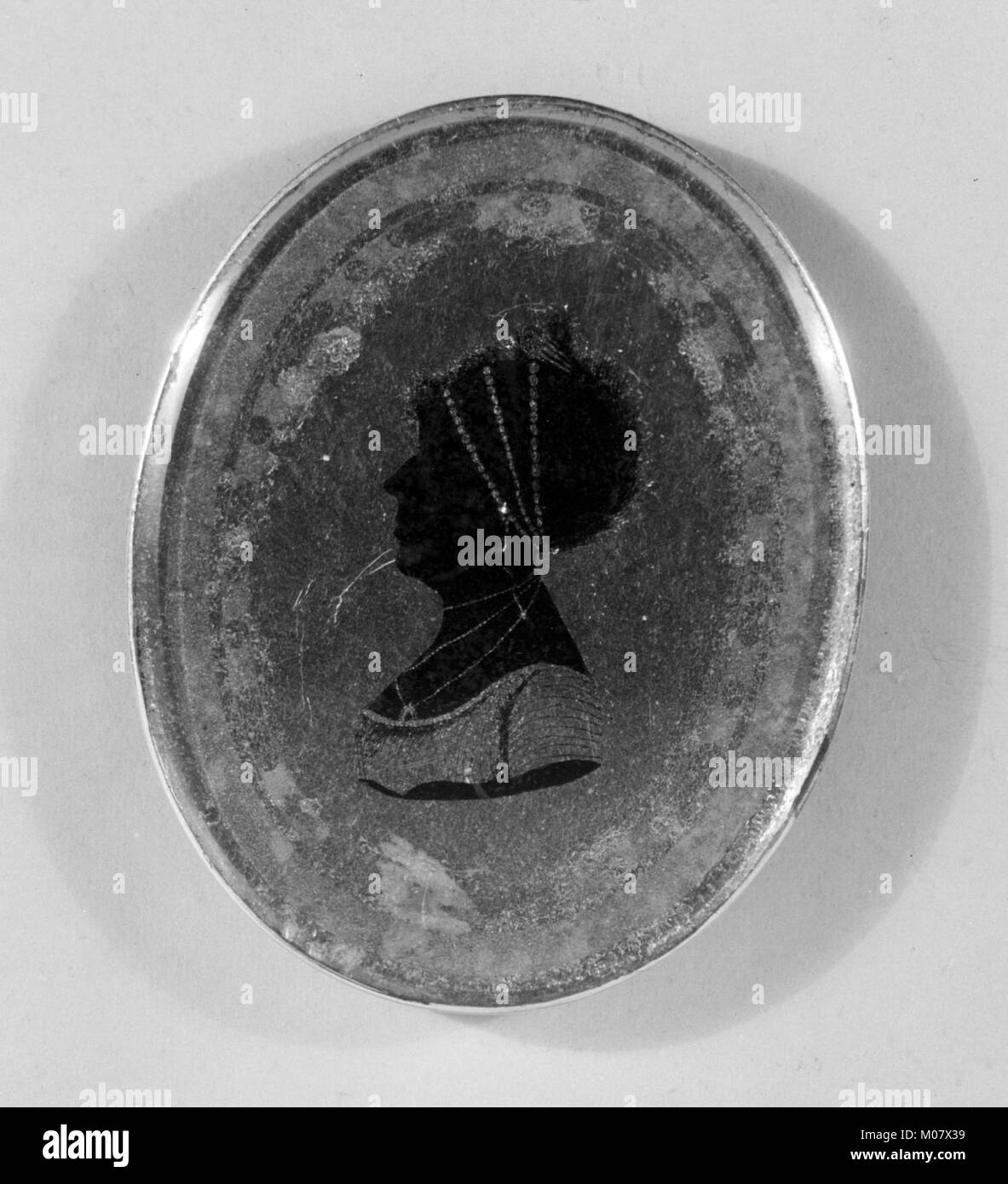 A medallion featuring artistic detail and symbolic meaning, serving as ...