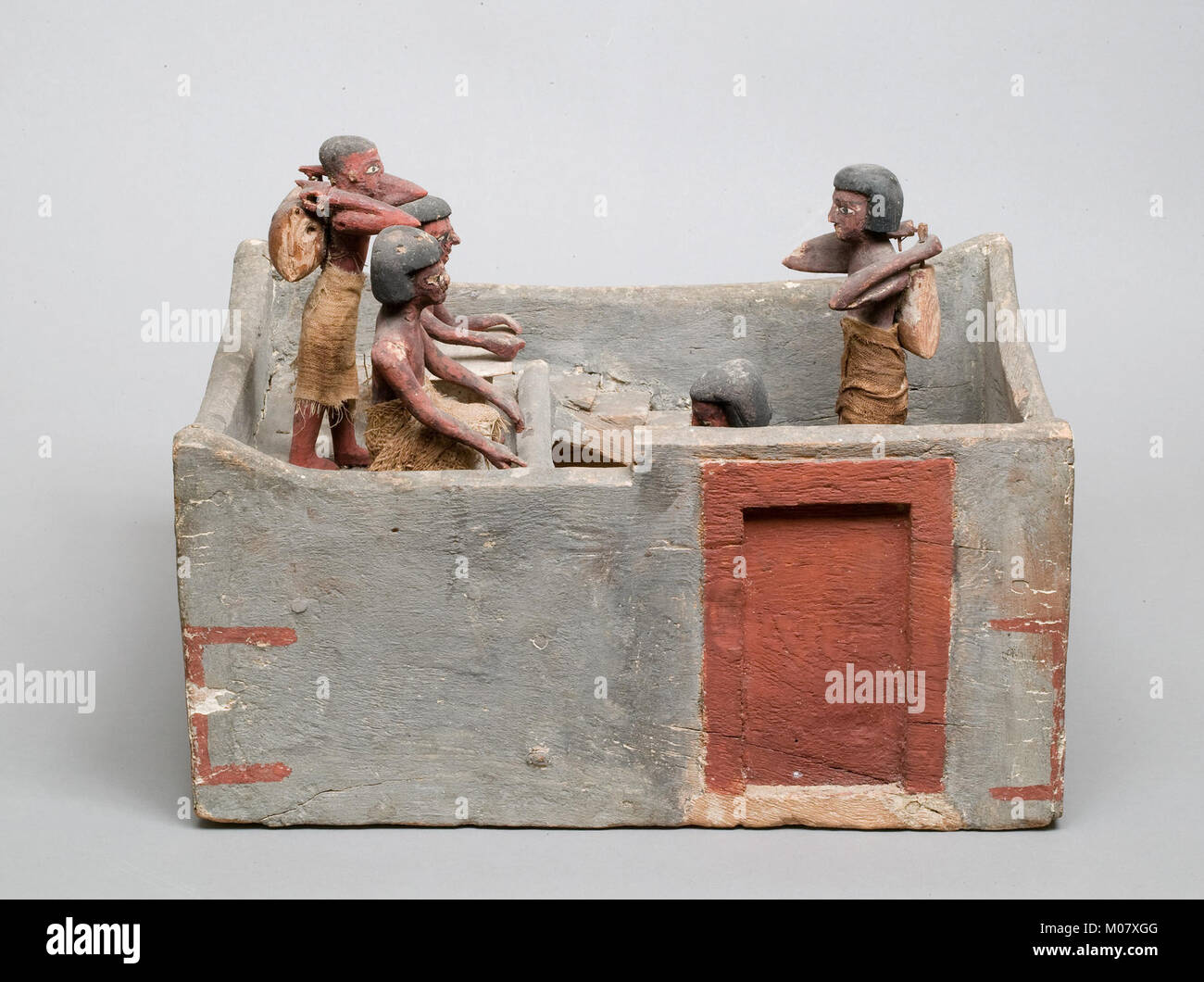 This model represents an ancient granary, complete with figures of a ...