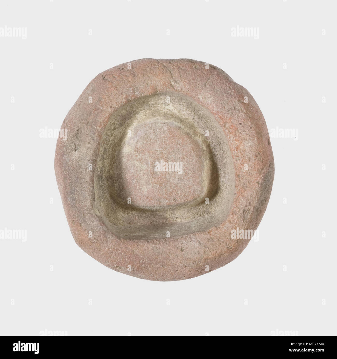 This mold, used for casting rings, is a crucial example of ancient ...