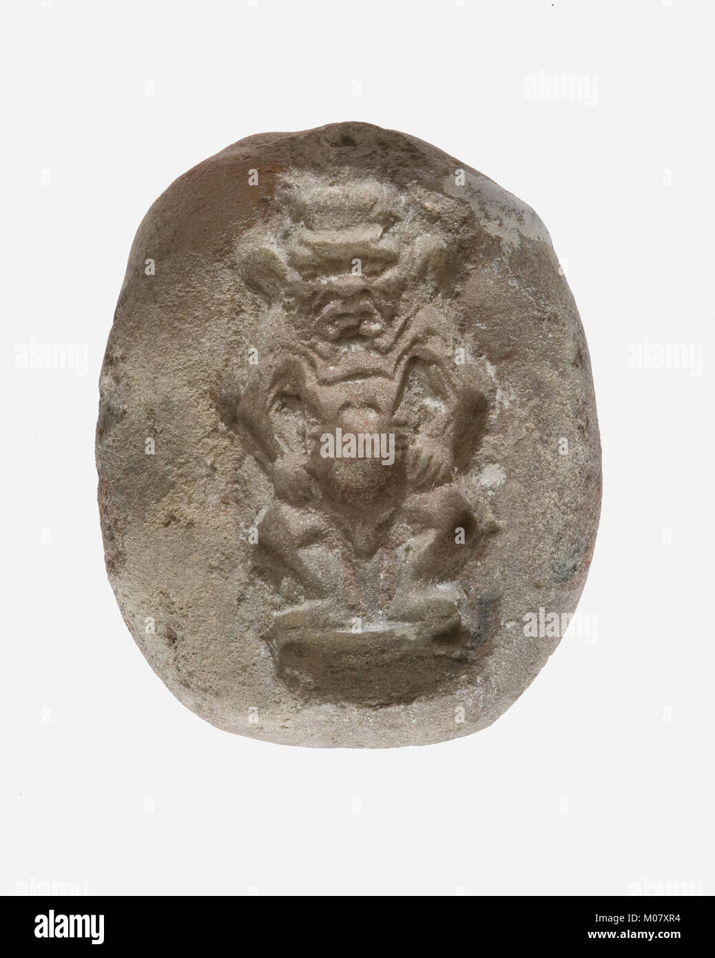 This mold, used to create a Bes amulet, is an example of ancient ...