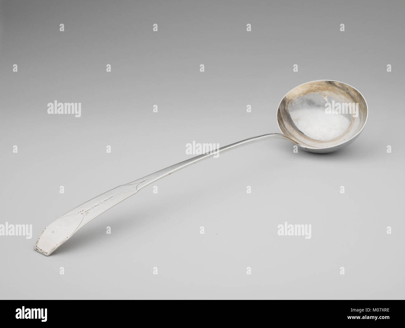 An ancient ladle designed for serving food or liquids, illustrating ...