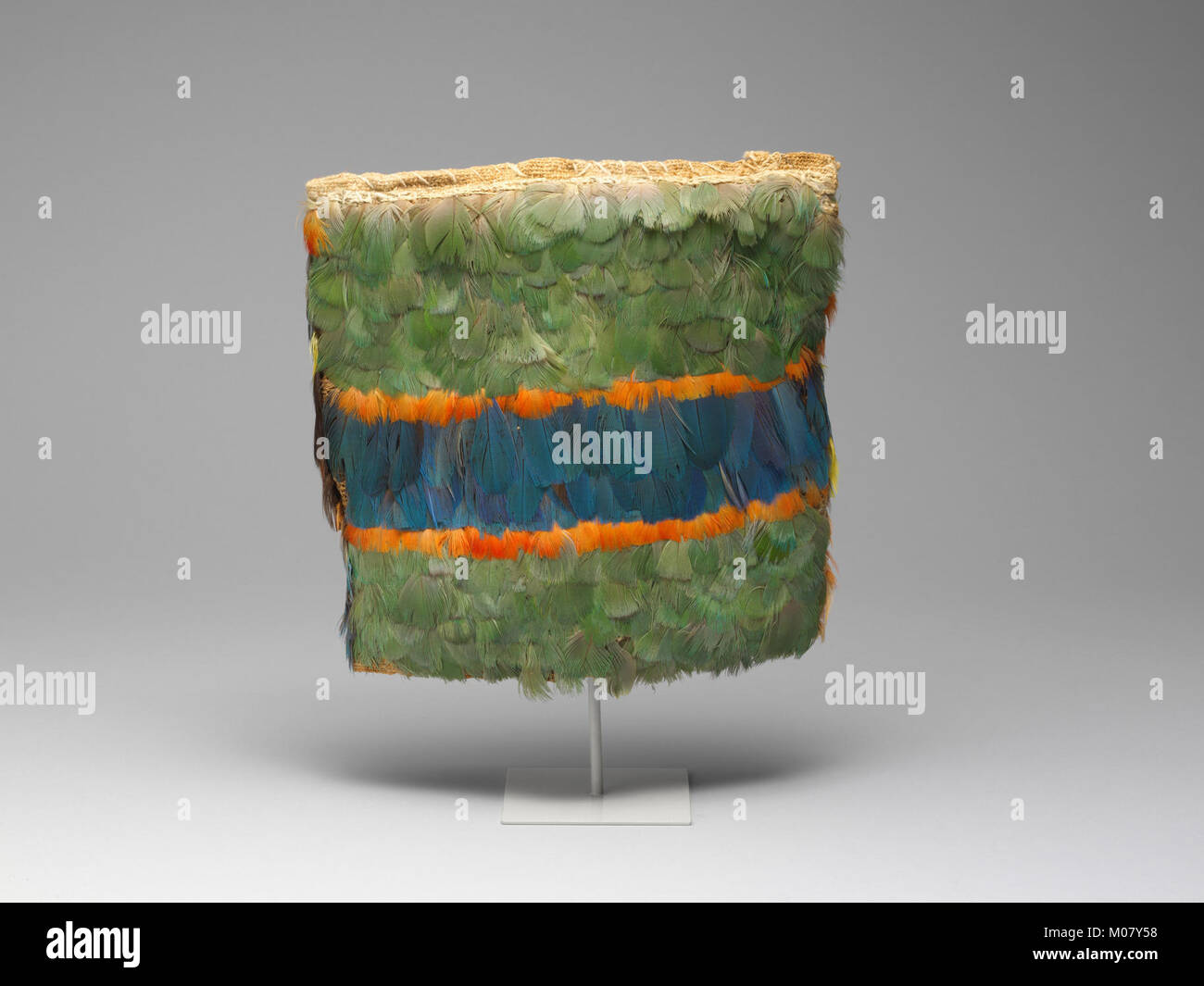 This miniature dress represents a detailed model of clothing from a ...