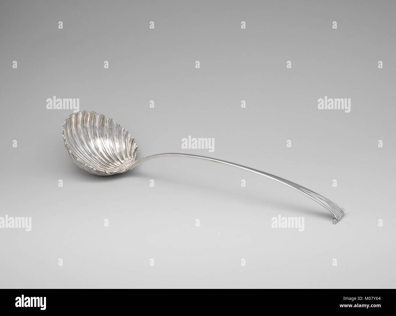 This ladle is a functional and decorative object from a historical ...