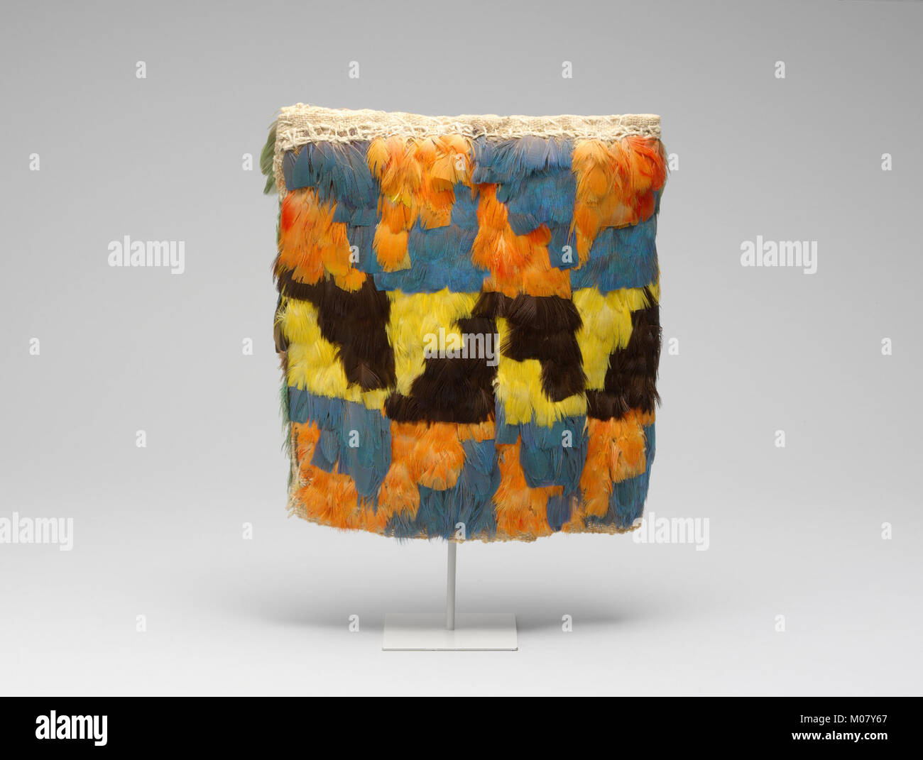 This miniature dress is a delicate piece of craftsmanship, reflecting ...