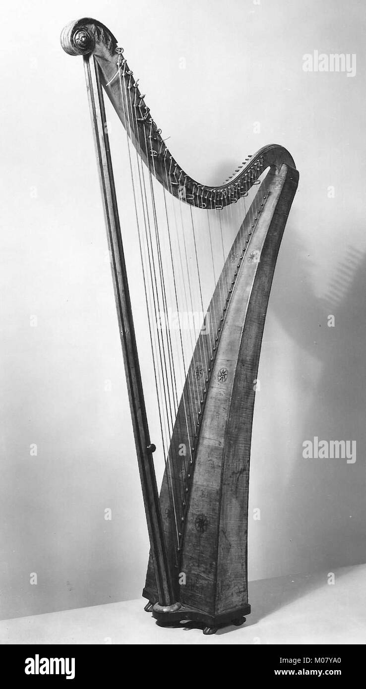 This hook harp, an ancient stringed instrument, features a distinctive ...
