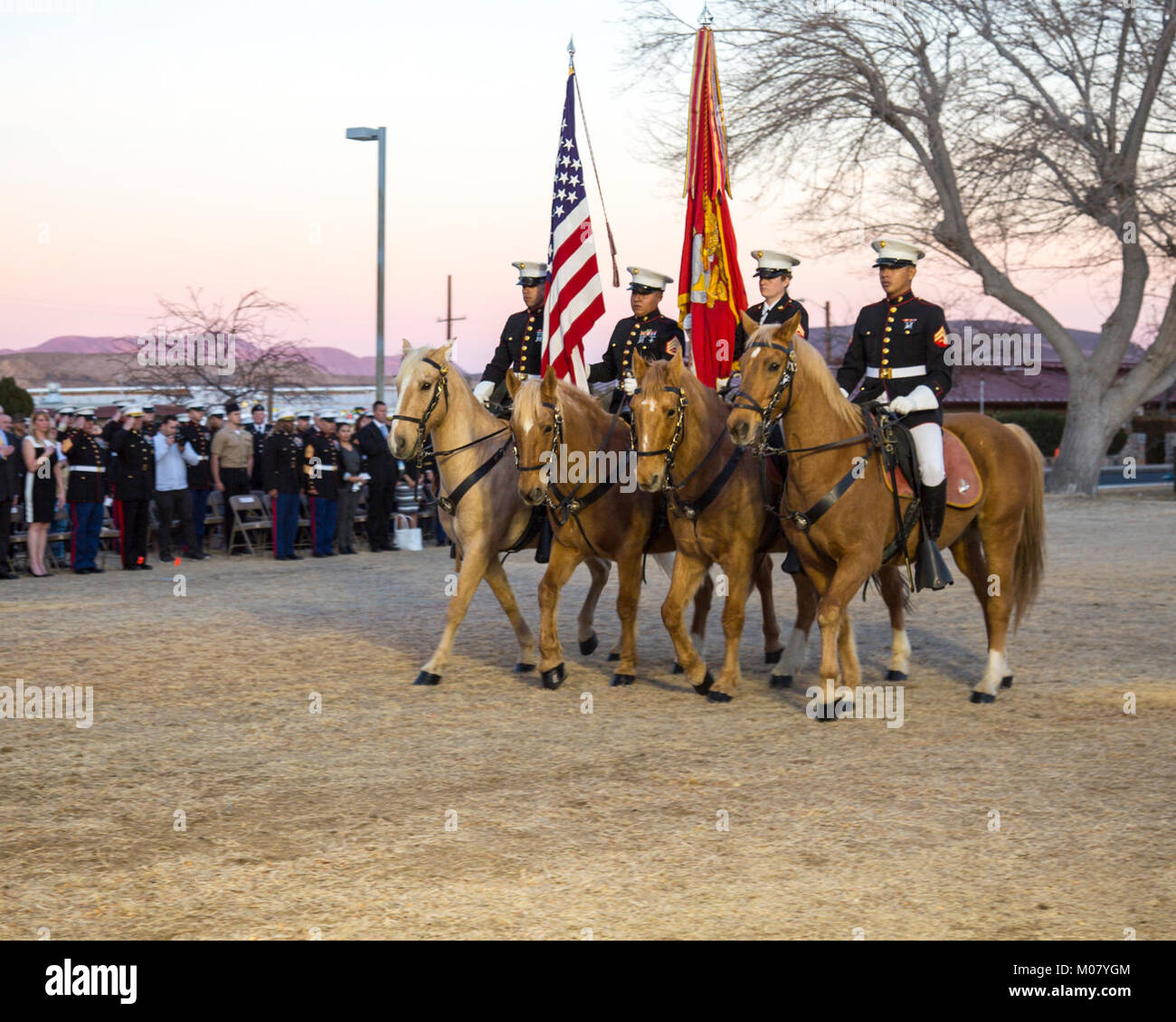 The Marine Corps Mounted Color Guard marches to the parade field to ...