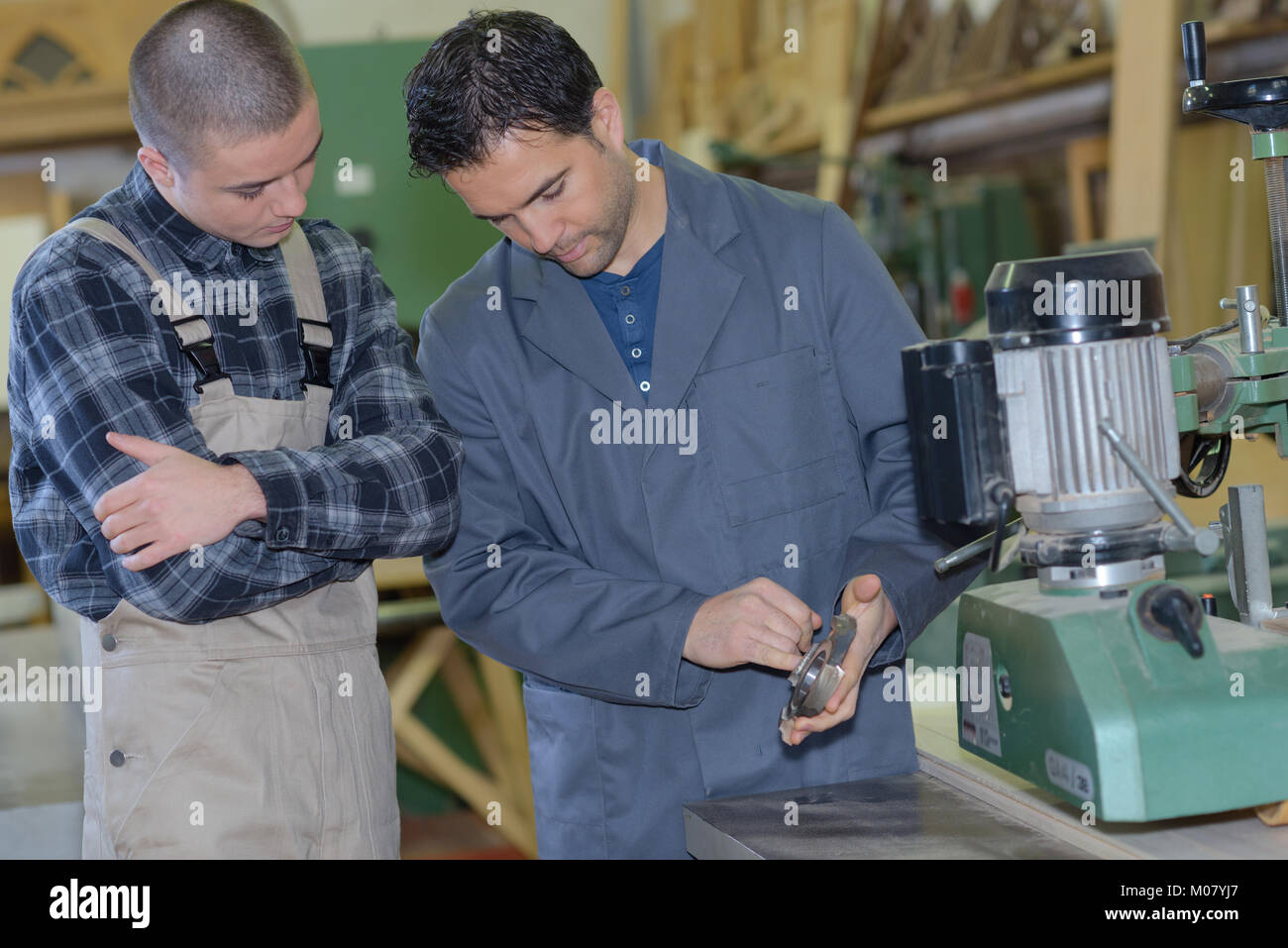 engineer and apprentice planning cnc machinery project Stock Photo - Alamy