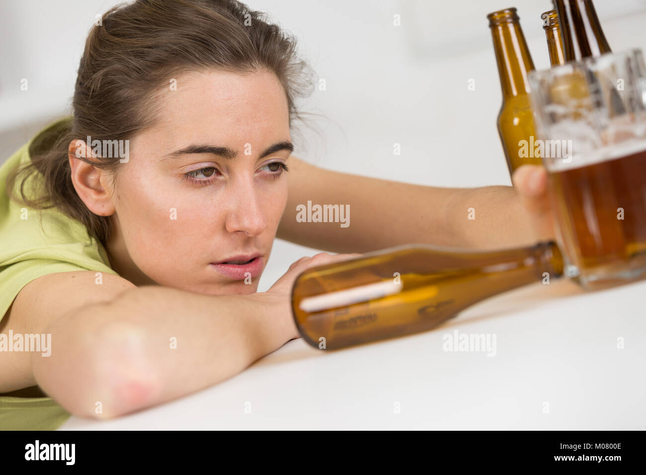 young drunk woman with bottles of beer Stock Photo - Alamy