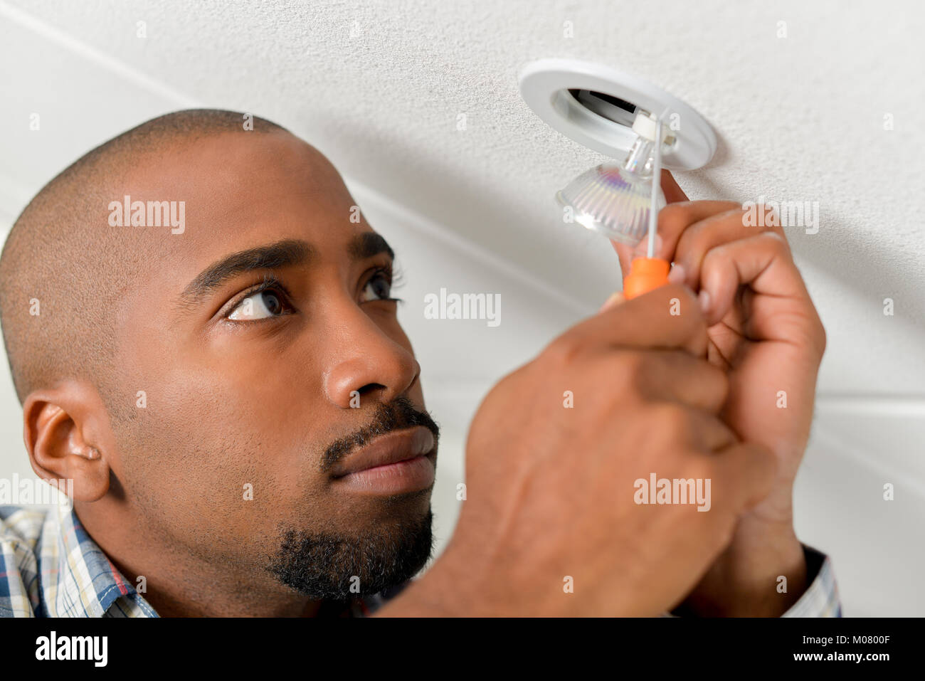 Replacing a light bulb hi-res stock photography and images - Alamy
