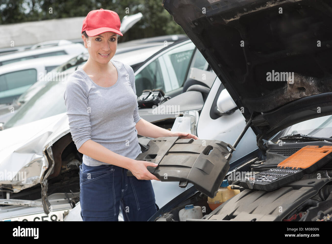 Mechanic examining under hood car hi-res stock photography and images ...