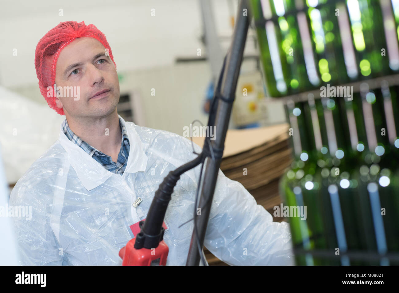 man working in a winery Stock Photo - Alamy