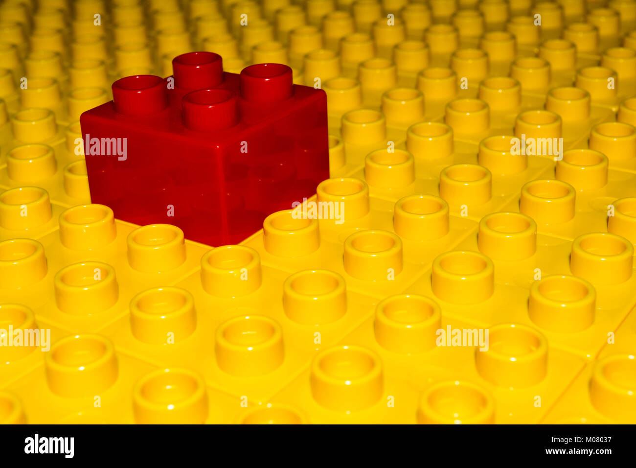 A sea of yellow building bricks all ligned up as far as they eye can ...