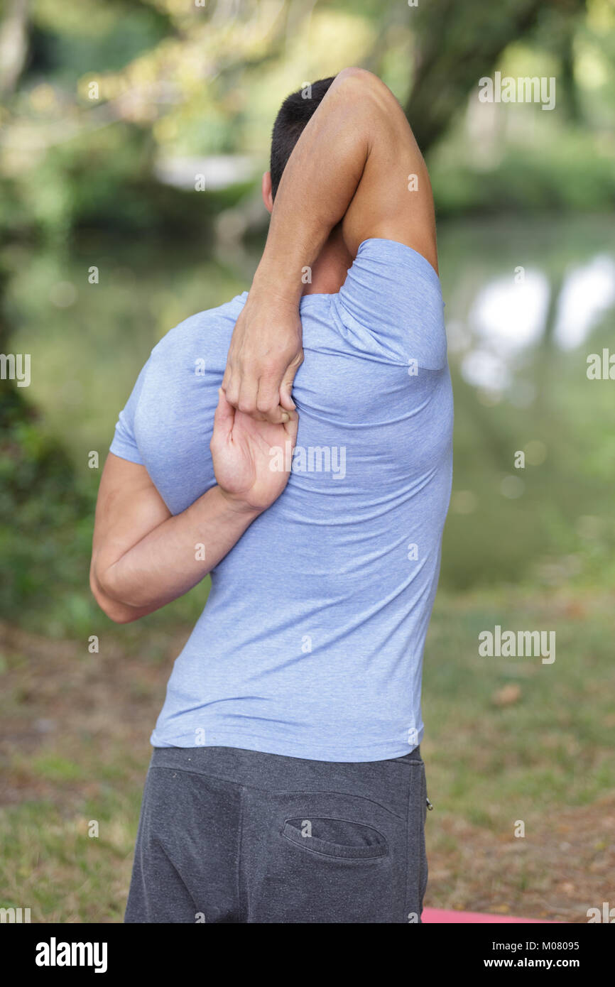man stretching his arm outdoor Stock Photo - Alamy