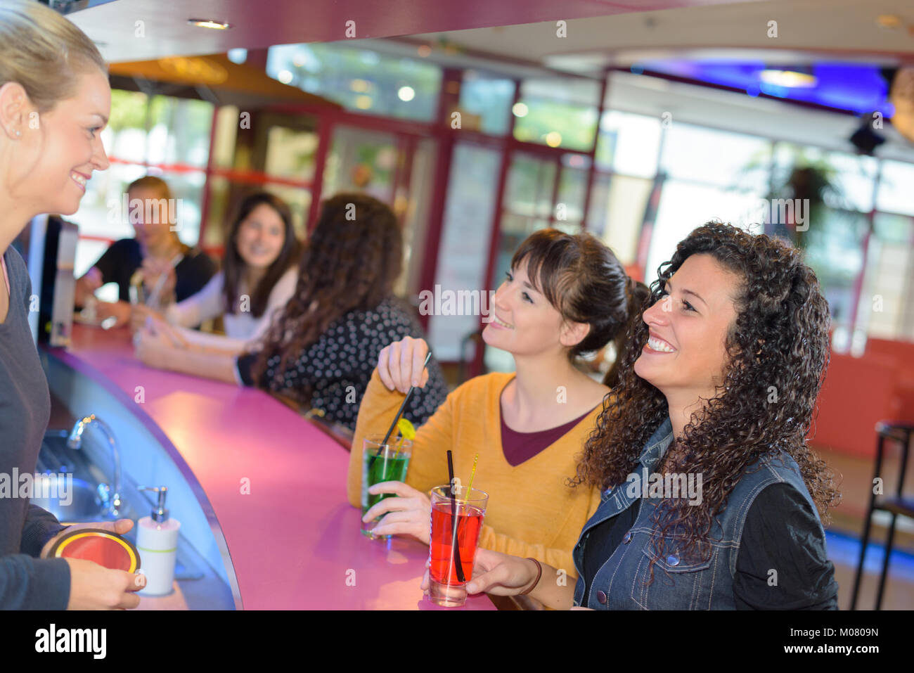Bartender talking to customers hi-res stock photography and images - Alamy