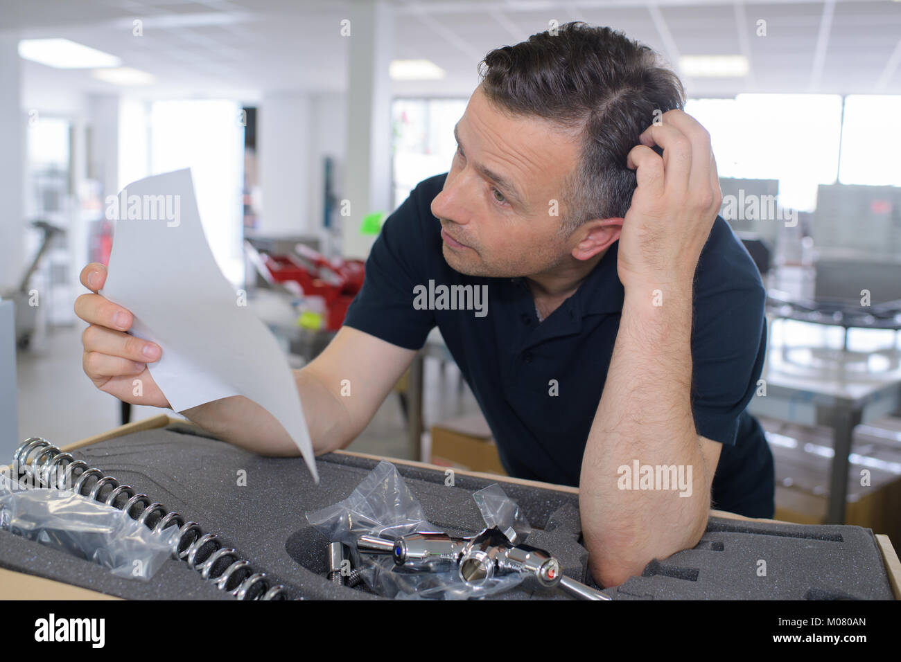 reading the manual Stock Photo - Alamy