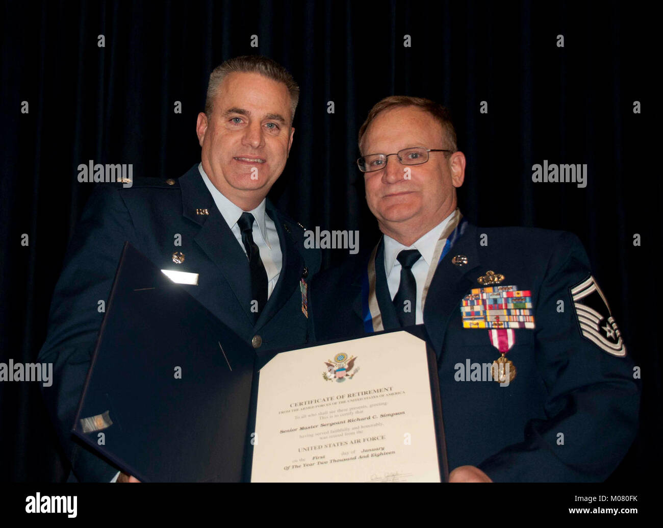 Senior Master Sgt. Rick Simpson receives his retirement certificate ...
