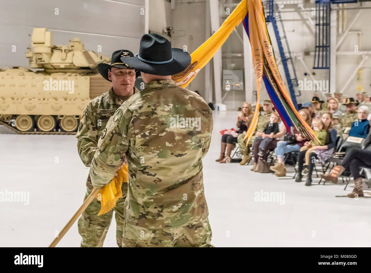 Col. Scott J. Sheridan, incoming commander, passes the brigade guidon ...