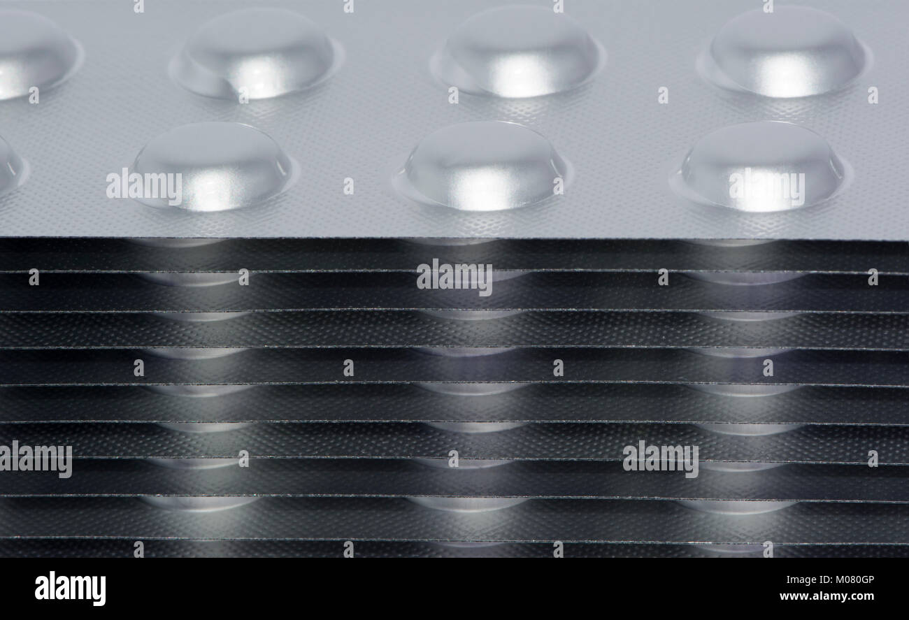 Pharmaceutical Drugs blister packs stacked up high and filled with ...