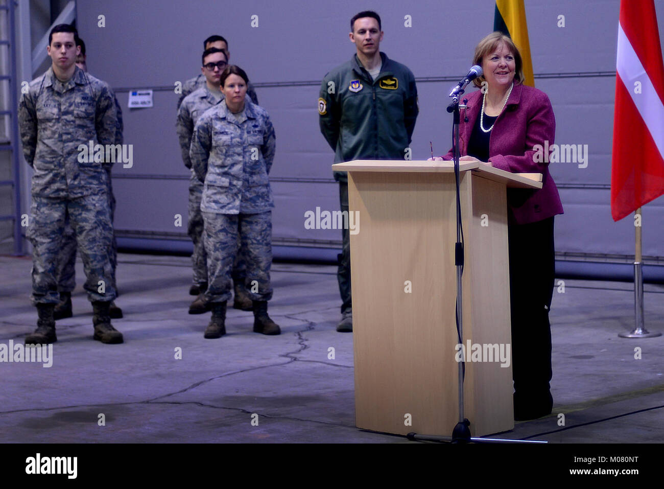 U.S. Ambassador Anne Hall congratulates U.S. Airmen from the 493rd ...