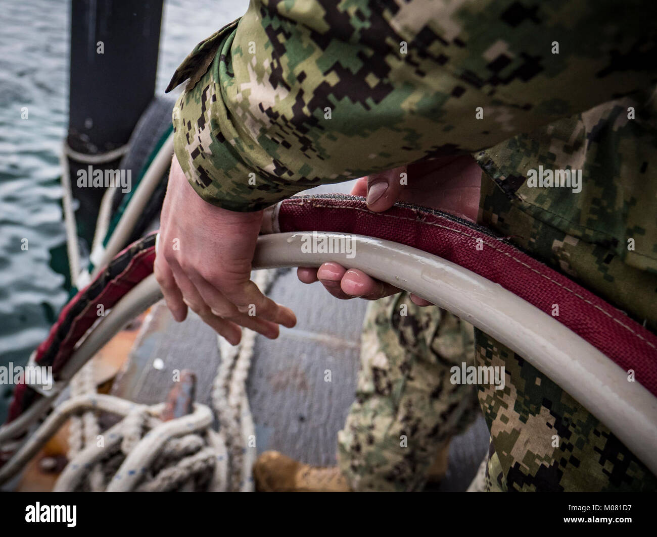 A U.S. Navy Seabee, assigned to Underwater Construction Team (UCT) 2 ...