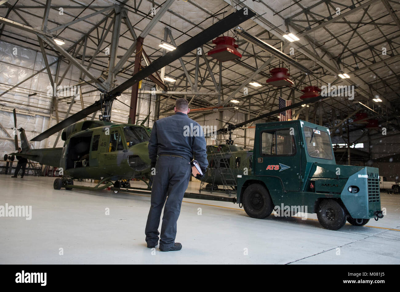 UH-1N Huey number 6648 is towed onto the flight line before taking off ...