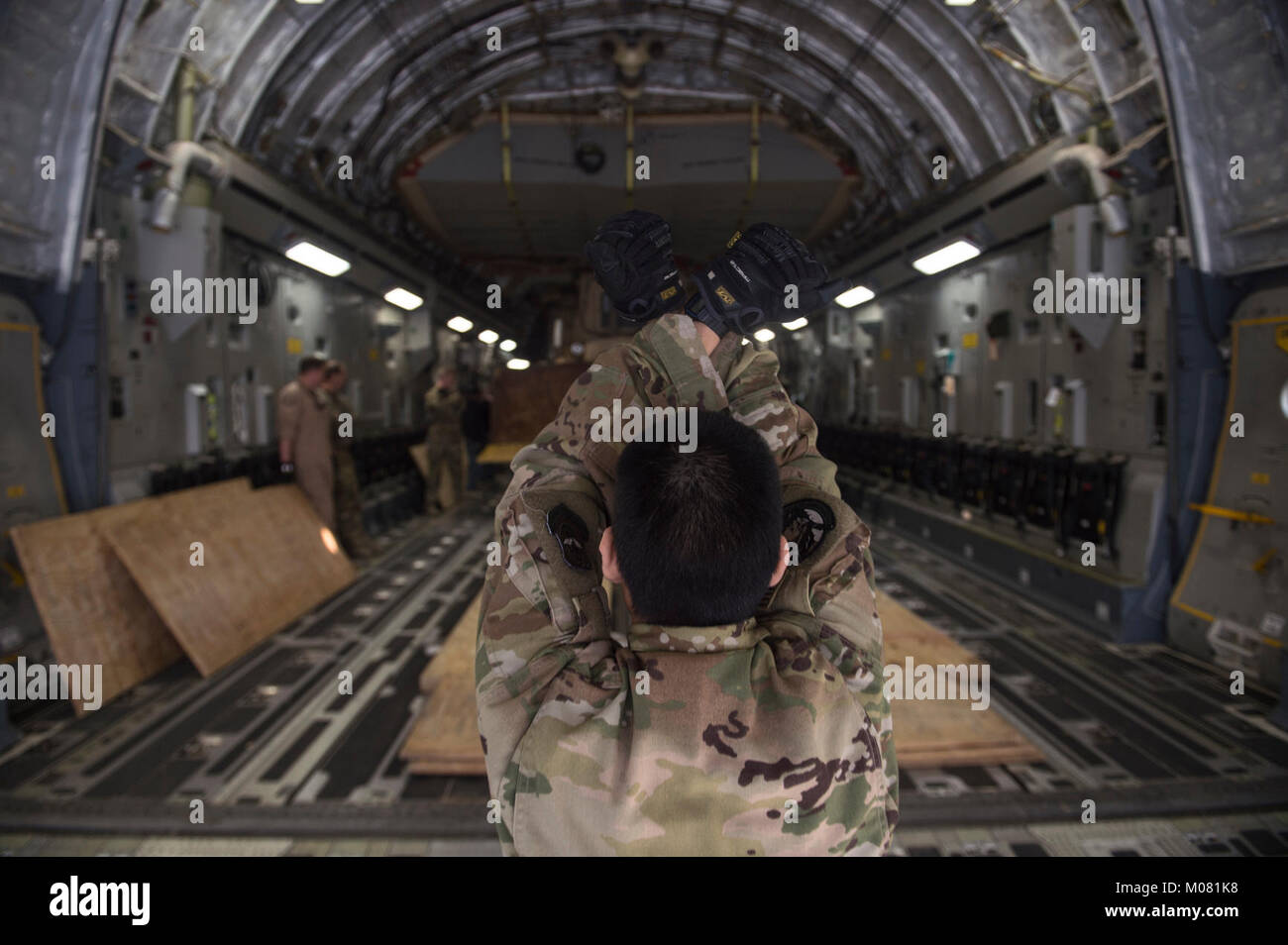 A U.S. Air Force C-17 Globemaster III loadmaster, assigned to the 816th ...
