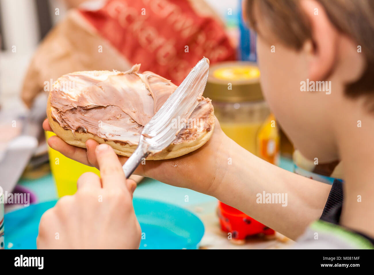 Closeup of boy preparing sweet sandwich with chocolate cream Stock ...