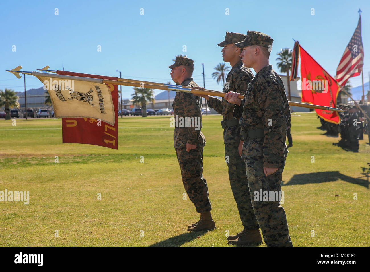A platoon from 1st Battalion, 7th Marine Division, gives a guidon ...
