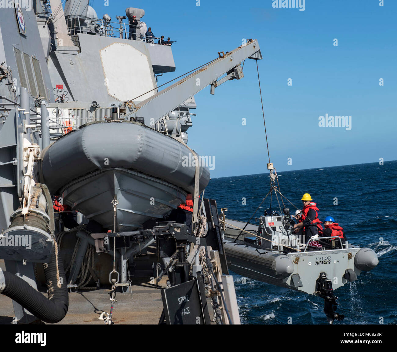 OCEAN (Jan. 14, 2018) A rigid-hull inflatable boat is retrieved by the ...