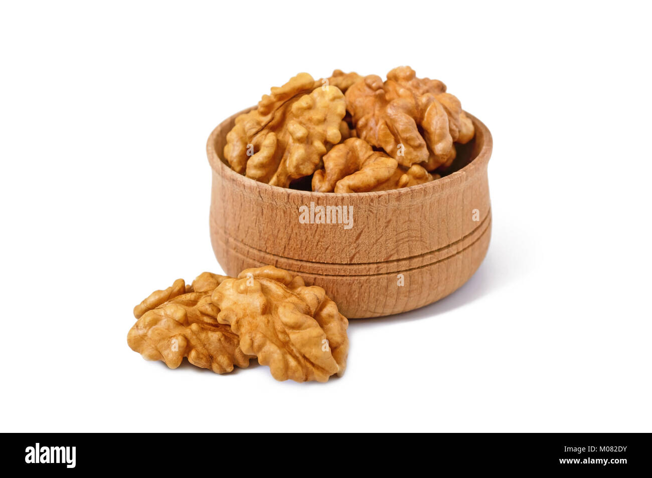 Walnuts kernels in a wooden bowl isolated on white background Stock ...