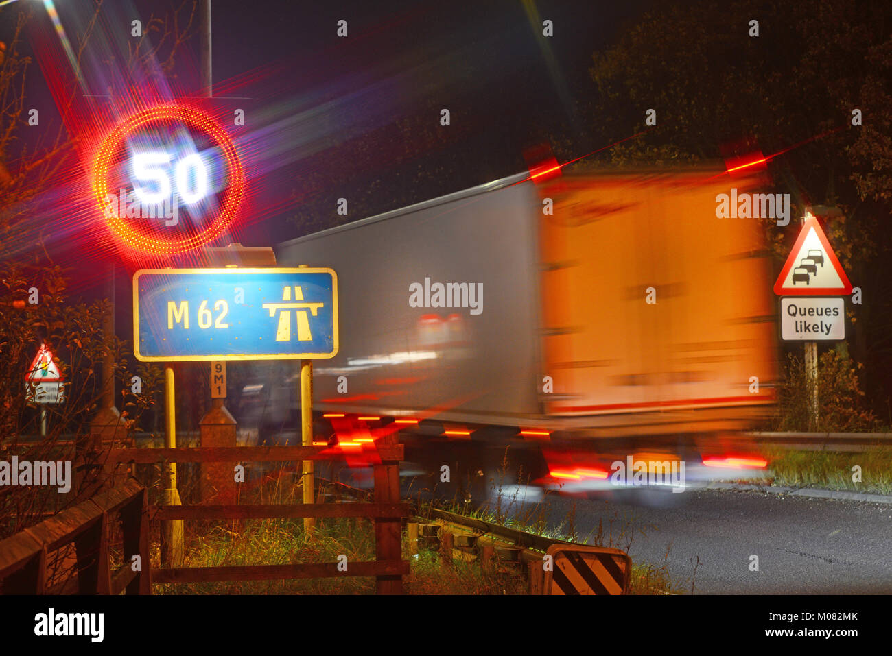 lorry passing reduced 50mph speed limit warning sign on the M62 ... lorry passing reduced 50mph speed limit warning sign on the M62 ...