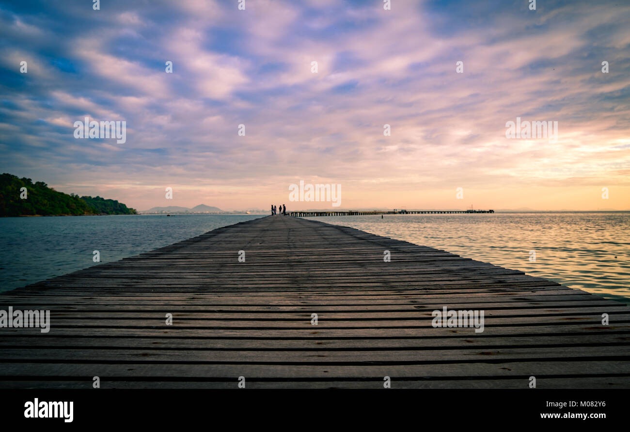 Wood bridge pier with beautiful sunrise sky and clouds in the morning ...