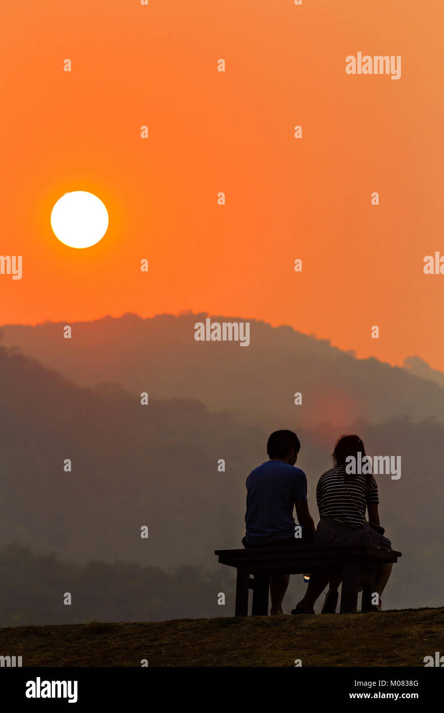 Couple Sitting On Bench At Sunset High Resolution Stock Photography and ...