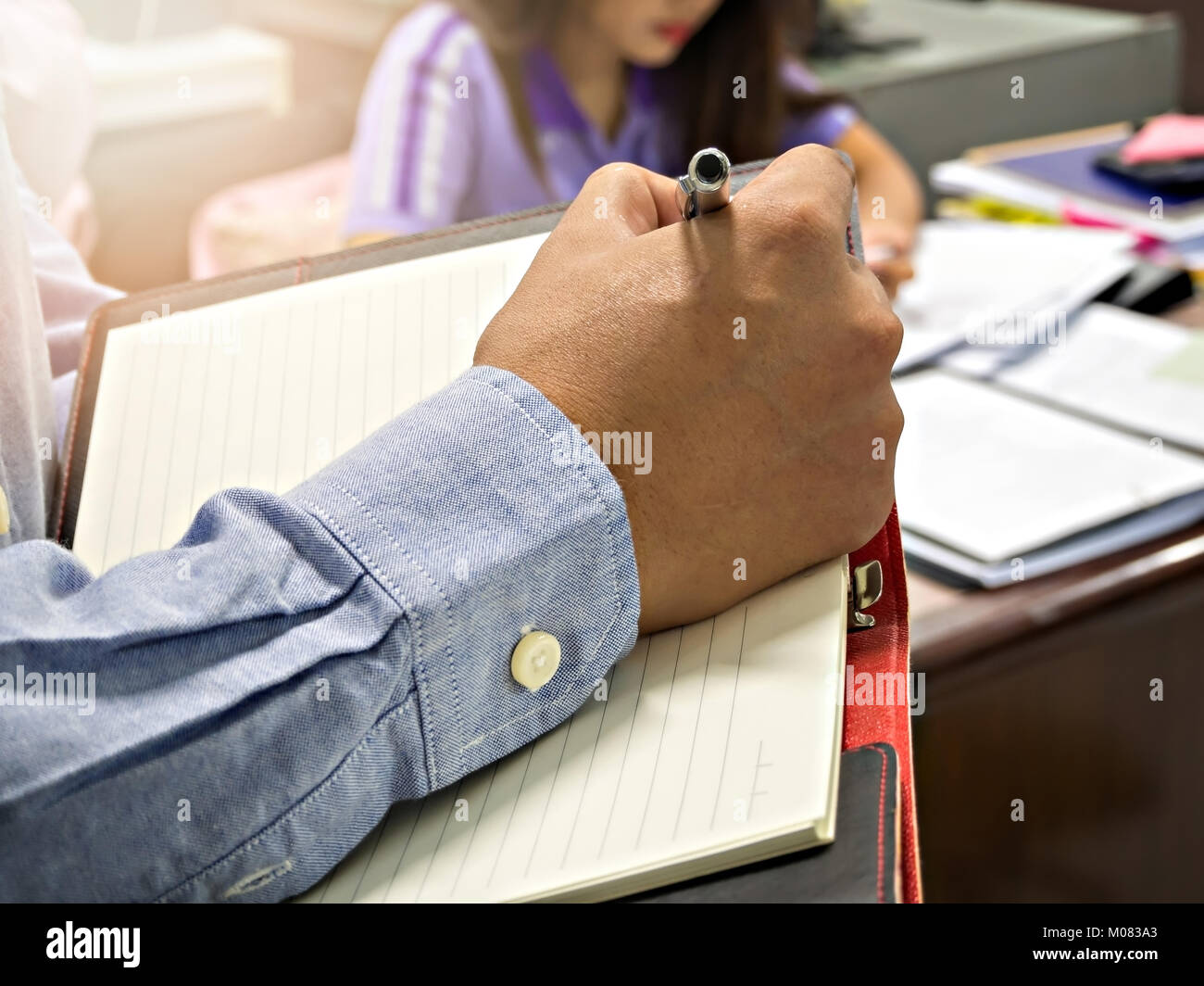 Close up shot businessman writing notes in notebook Stock Photo - Alamy